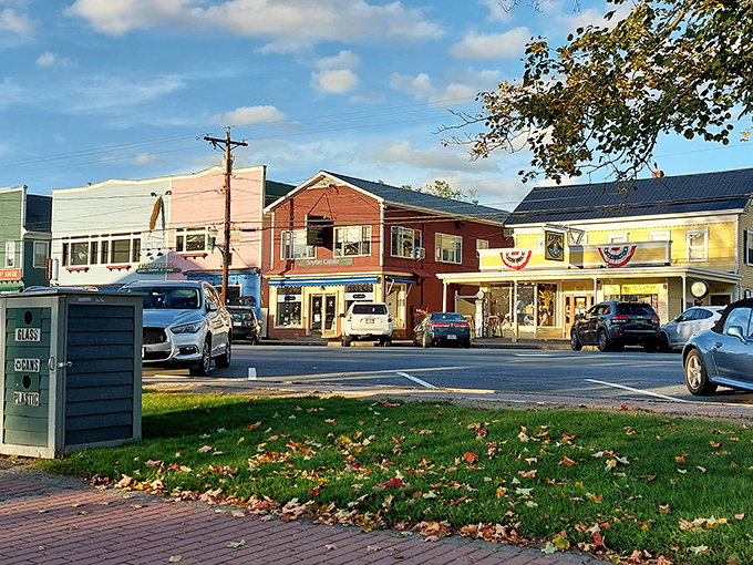 North Conway's colorful storefronts pop against autumn's fiery display, creating a shopper's paradise worth the drive.