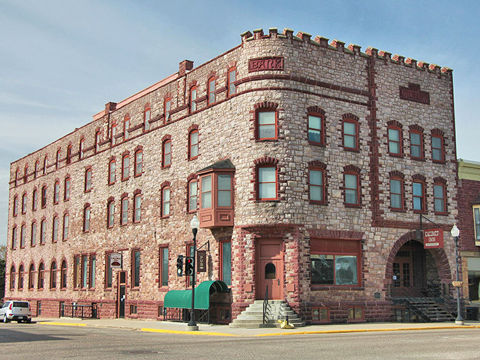 Pipestone's unique red stone buildings glow warmly in the sunlight like nowhere else you've ever visited before.