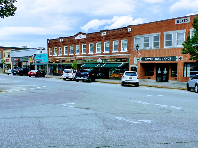 Plymouth's distinctive red building with white awnings stands as a cheerful landmark in a town where college-town energy meets budget-friendly prices.