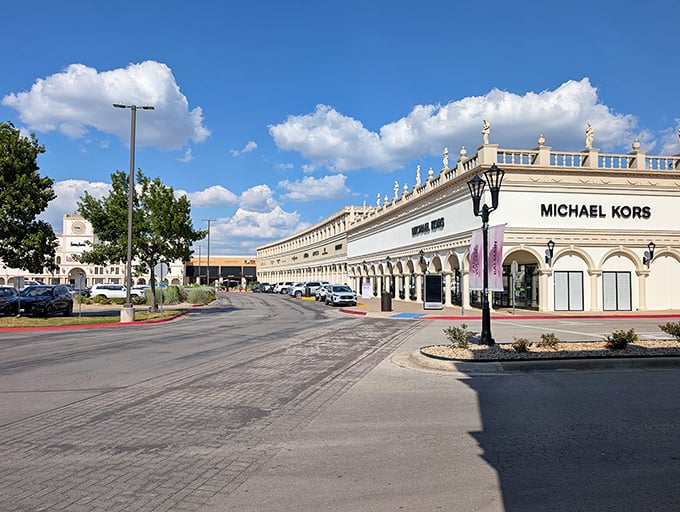 This sprawling outlet center stretches across the horizon like a small town dedicated entirely to the noble art of bargain hunting.