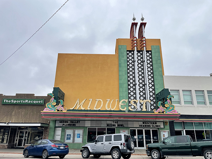 Deco dreams in technicolor! Alliance's MIDWEST theater facade pops like a Wes Anderson movie set&mdash;quirky, vibrant, and utterly unforgettable.
