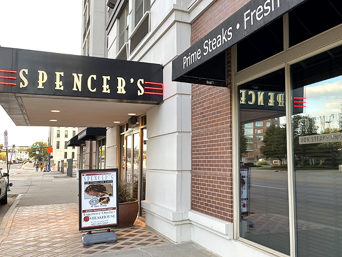 Spencer's sleek urban façade promises a contemporary steakhouse experience where Nebraska beef meets metropolitan sophistication.