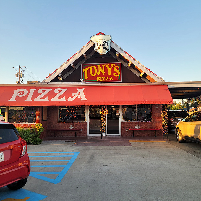 Tony's cheerful chef mascot has been welcoming hungry folks for generations. That red awning isn't just decoration&mdash;it's a pizza runway.