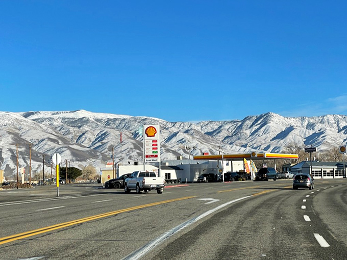 The dramatic Sierra Nevada mountains create a stunning backdrop for Bishop's main highway and local Shell station.