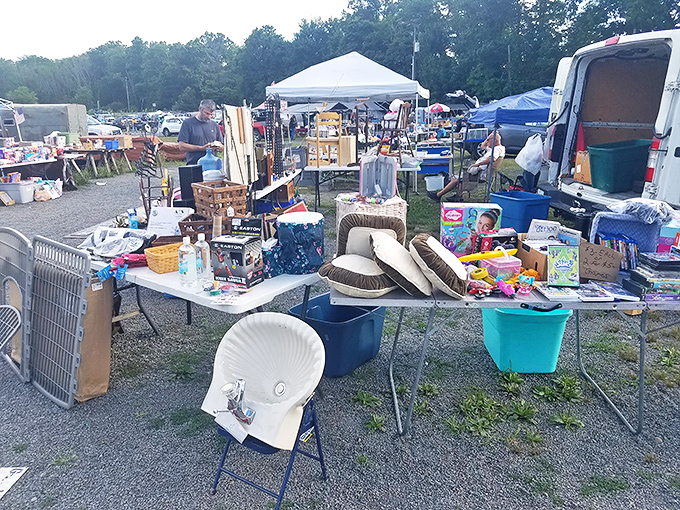 Treasure table temptations! This eclectic display includes everything from cowboy hats to children's toys, proving one person's castoffs become another's treasures.