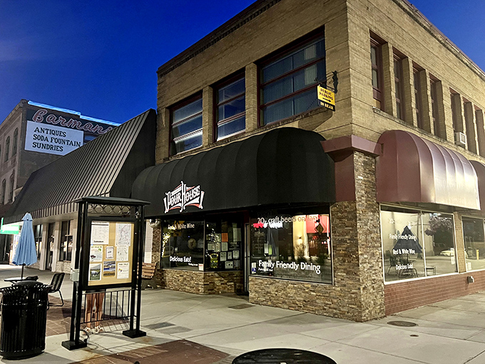 Colville&rsquo;s main street glows at dusk, offering everything you need without big-city prices &mdash; where &ldquo;downtown&rdquo; still means down-to-earth living.