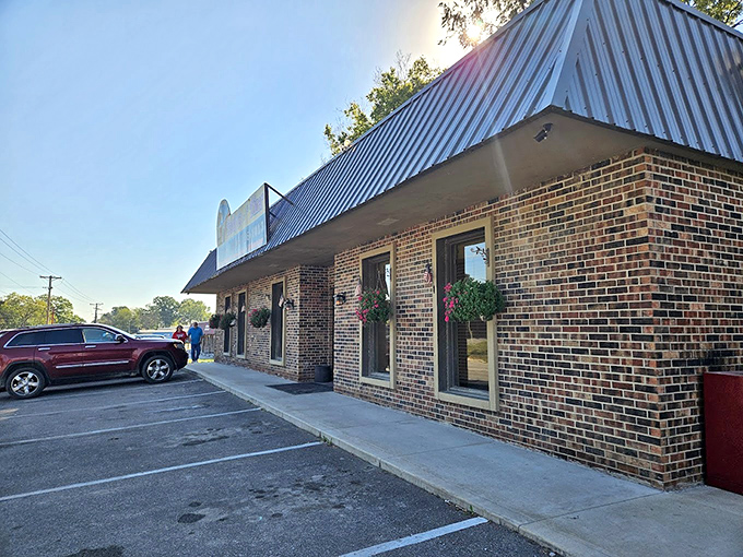 Hanging flower baskets add a touch of homey charm to this local institution where regulars have their own mugs.
