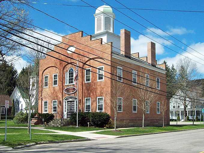 The brick courthouse anchors Ellicottville's downtown like a stately reminder of this mountain town's proud heritage.
