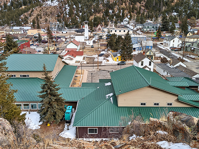Georgetown's Victorian architecture stands preserved in time, with mountain walls creating a natural frame for this historic gem.