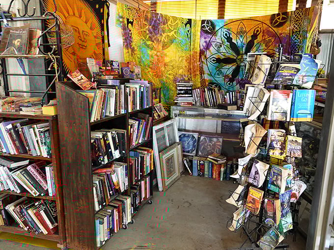 Books tower like literary skyscrapers while shoppers navigate aisles filled with life's forgotten but wonderful necessities.