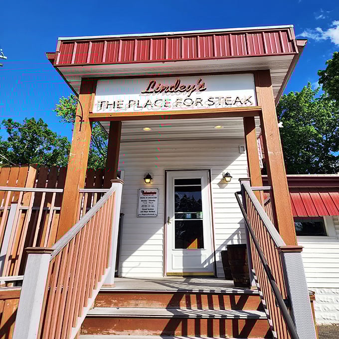That wooden deck and homey entrance at Lindey's promises the kind of unpretentious steak experience that makes memories.