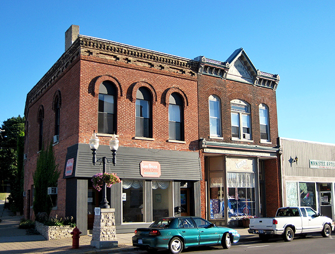 The heart of Manistee beats along its historic streets, where century-old buildings house modern dreams in vintage packages.