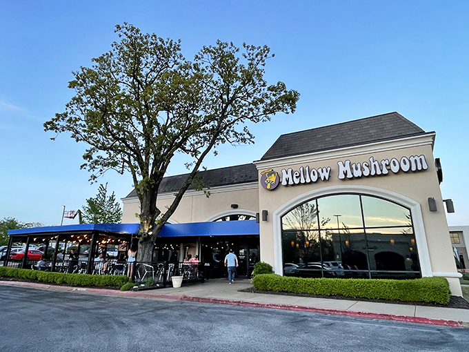 A bold sign and a buzzing patio hint at the playful pizza creations inside this Fayetteville favorite.
