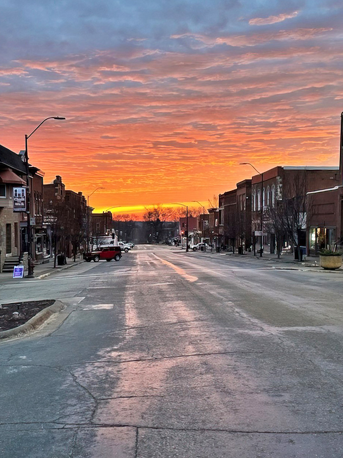 This classic Iowa main street captures small-town perfection, where historic brick buildings frame a community that values both education and tradition.