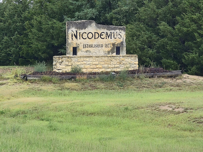 The Nicodemus welcome sign marks a National Historic Site where African American pioneers built dreams on Kansas soil.
