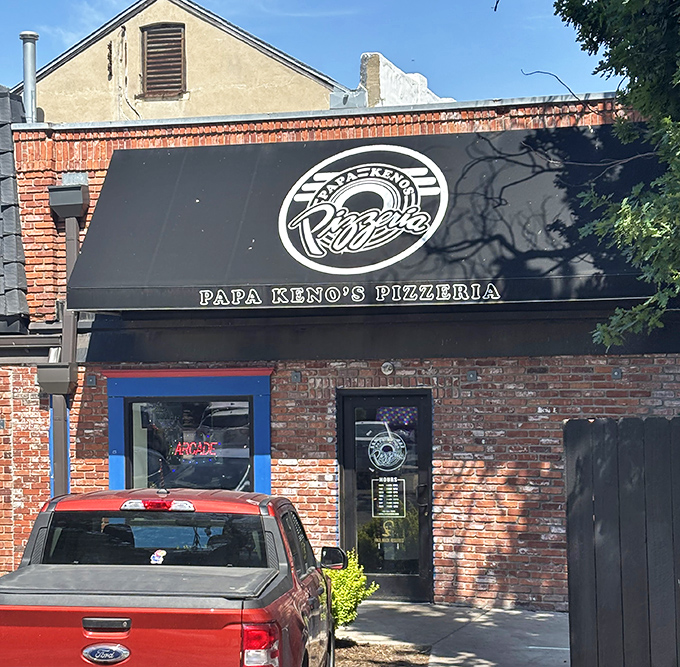 Urban pizza paradise! Papa Keno's awning creates the perfect shelter for contemplating life's important question: one giant slice or two?