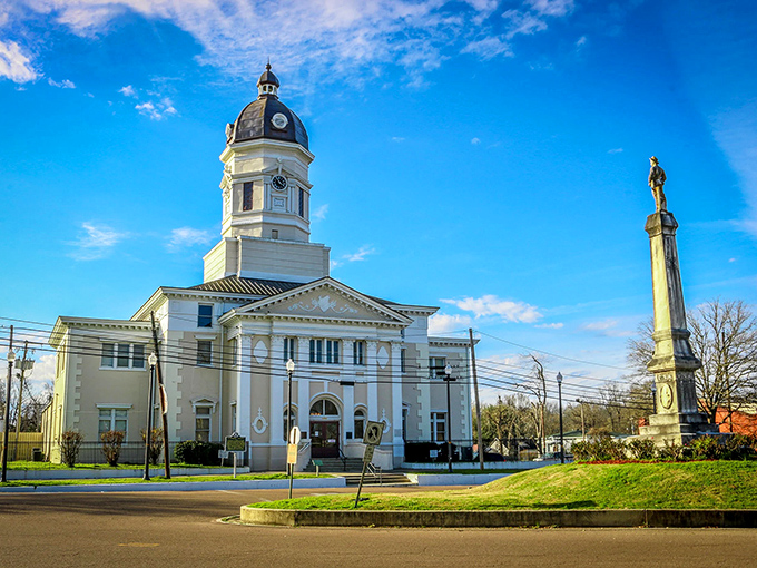 The white courthouse stands like a beacon of Southern grace, surrounded by buildings that refused to fade away.
