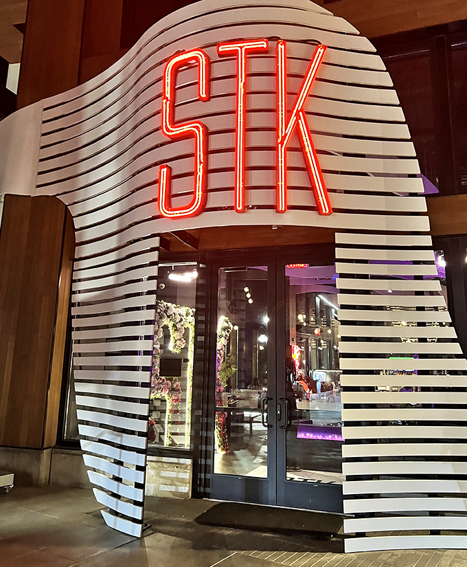 STK's illuminated entrance glows like a portal to meat nirvana. The nightclub where steaks are the real celebrities.