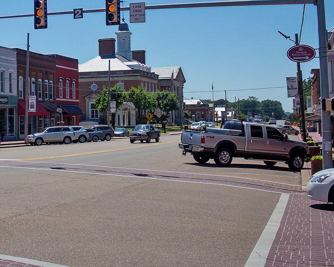 Small-town main streets like this remind us that community matters more than crowds and neighbors still wave hello.