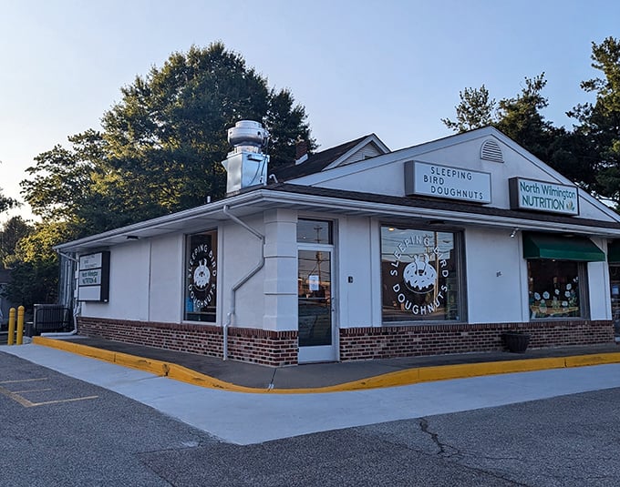 Corner shop magic! Sleeping Bird Doughnuts' cozy white building houses some of Wilmington's most creative circular confections.