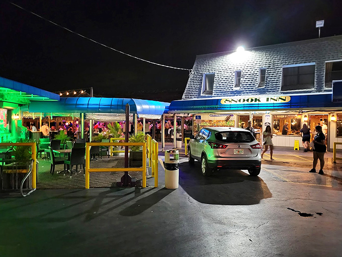 Evening lights reflect off the water, illuminating this waterfront haven for serious seafood enthusiasts.