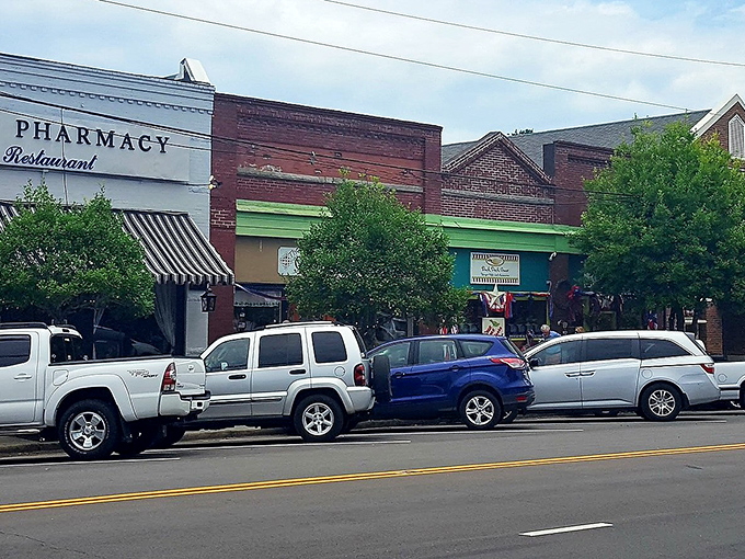 You can almost hear the hum of friendly chatter and the clink of coffee cups behind those shopfronts.