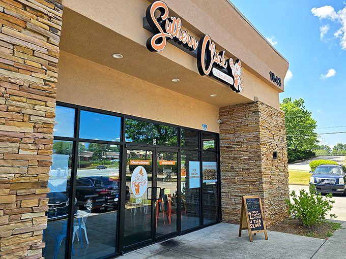 Sunshine highlights Suthern Cluck's welcoming entrance. The stone exterior might be new, but inside they're honoring age-old Southern cooking traditions.