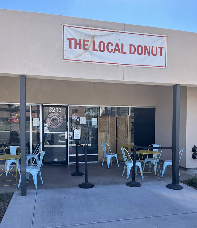 Blue chairs welcome visitors to linger at The Local Donut. A modern space where maple bacon dreams come true.