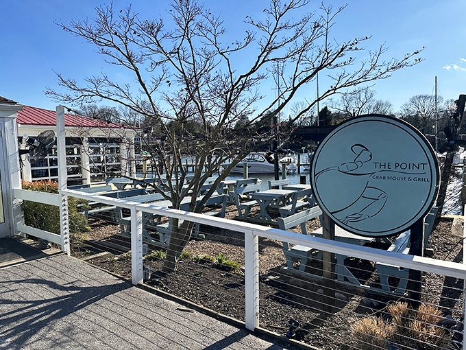 Winter can't dim The Point's waterfront charm. Where bare trees frame boats waiting for warmer days.