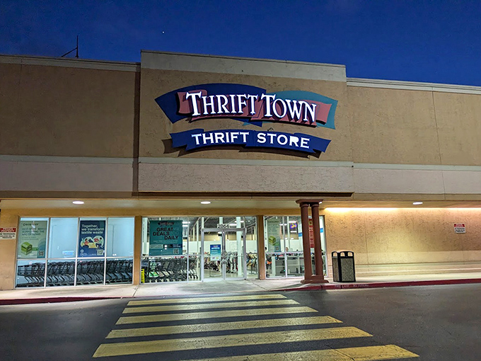 Evening shopping takes on a magical quality at Thrift Town. The illuminated storefront beckons night owls to discover after-dark deals.