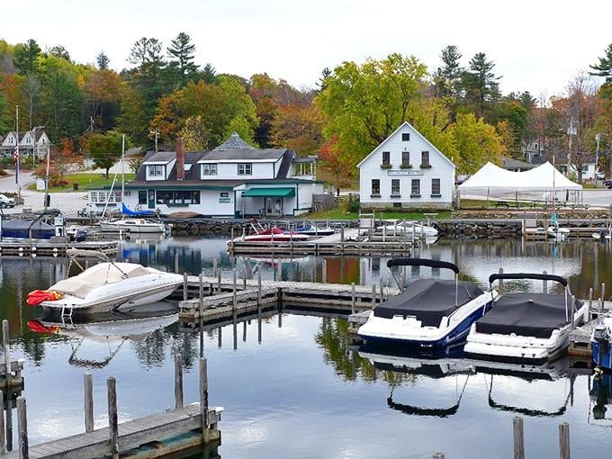 This peaceful harbor reflects both boats and buildings, creating a mirror image of New England's maritime heritage and natural beauty.