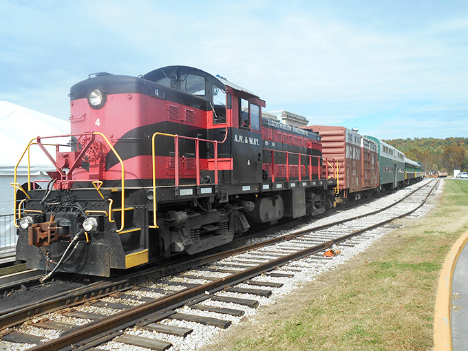 The bold red and black A.W. & N.W. locomotive commands attention, a powerful reminder of the industrial might that connected American communities.