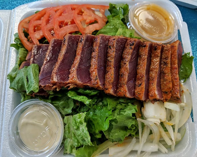 The seared ahi salad is minimalist perfection &ndash; ruby-red tuna with a whisper of sear, crisp greens, and just enough accompaniments to make the fish the undisputed star.