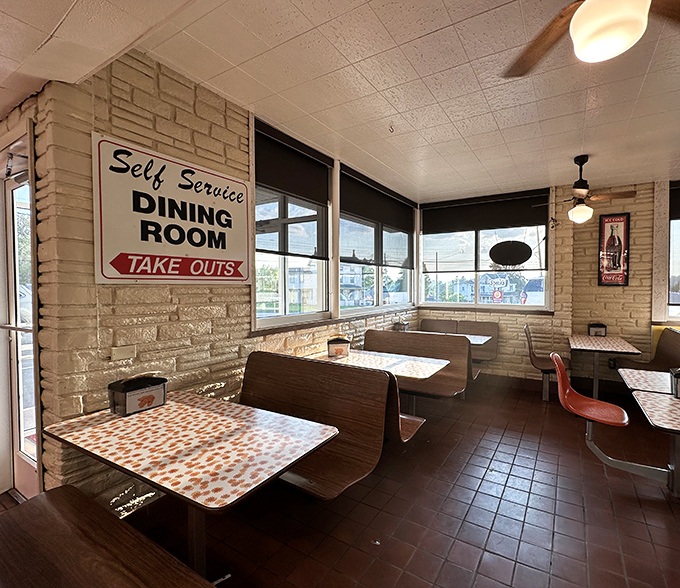 Wooden booths and retro tables in the self-service dining room create an atmosphere where conversations flow as easily as the refills.