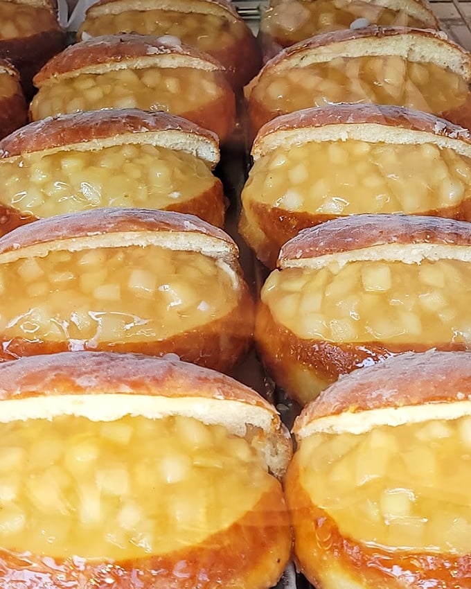 These apple-filled donuts look like they're smuggling sunshine and happiness inside their glazed exteriors.