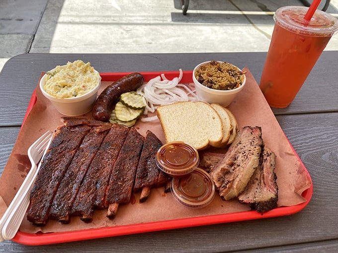 The barbecue platter: where decisions are made for you, and they're all correct. Ribs, brisket, sausage, and sides in perfect harmony.