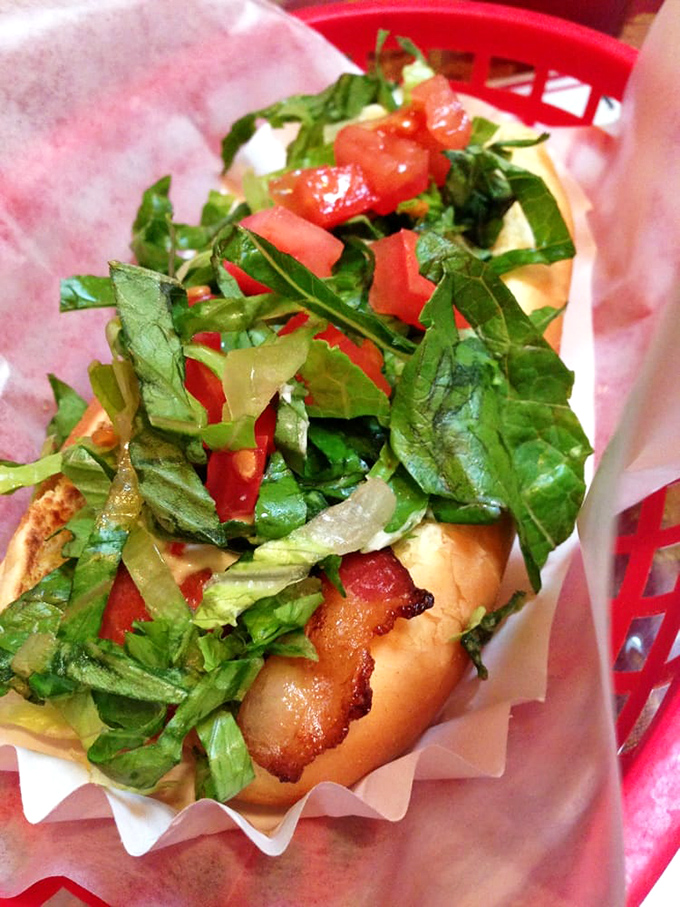 Fresh greens and bacon transform this dog into a handheld BLT masterpiece. Who needs bread when you've got a perfectly toasted bun?