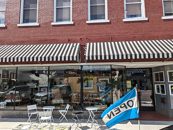 Classic awnings shade sidewalk seating where coffee and conversation flow freely, the original social network that never crashes.