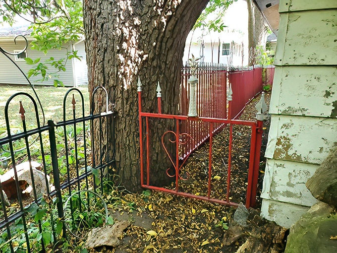 The garden's pathways invite exploration, with colorful gates guiding visitors through a journey that's both physical and contemplative.