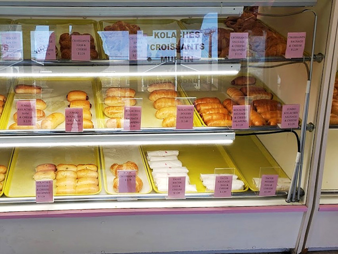 A display case full of morning miracles, each pastry patiently waiting to make someone's day better.