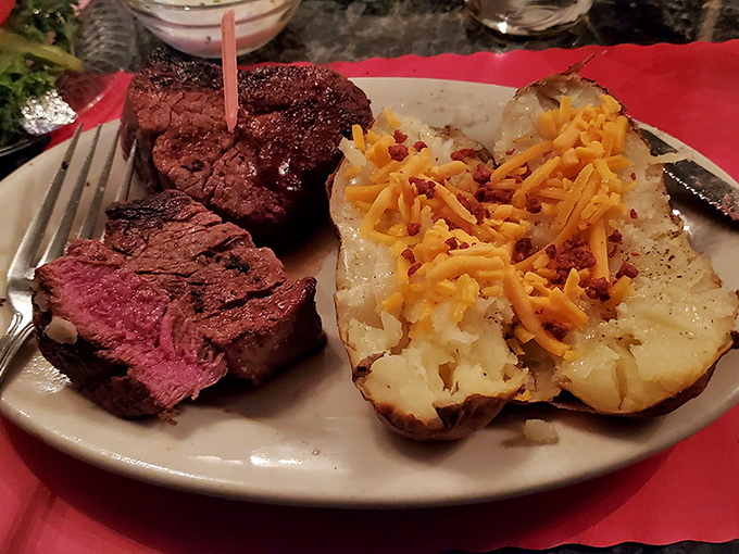 Medium-rare perfection meets loaded baked potato&mdash;a classic American duet performing their greatest hits on a simple white plate.