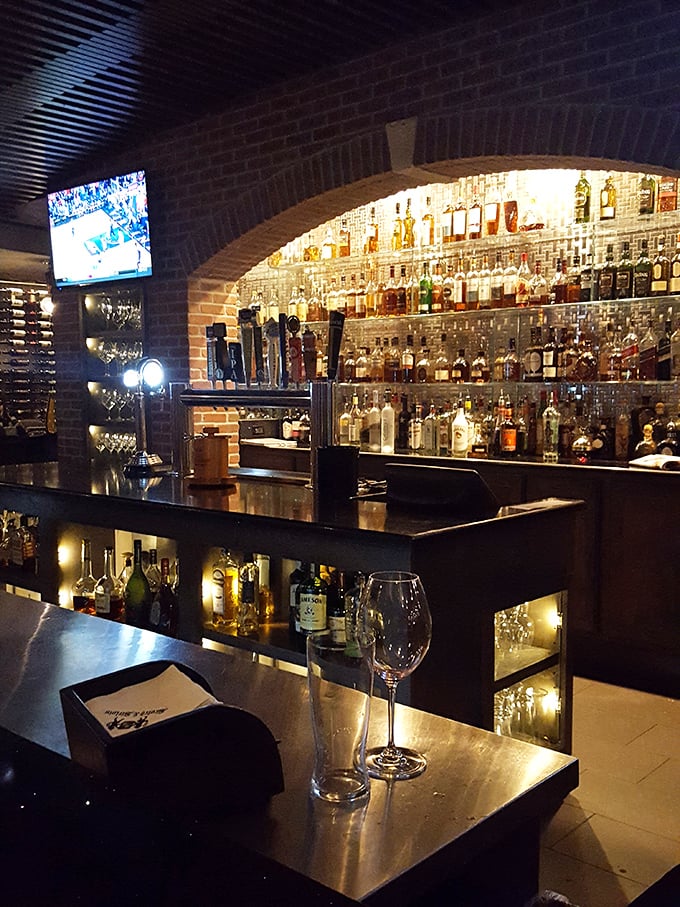 Behind this bar, bottles glitter like treasure in a cave&mdash;liquid gold for grown-ups who've earned their relaxation time.