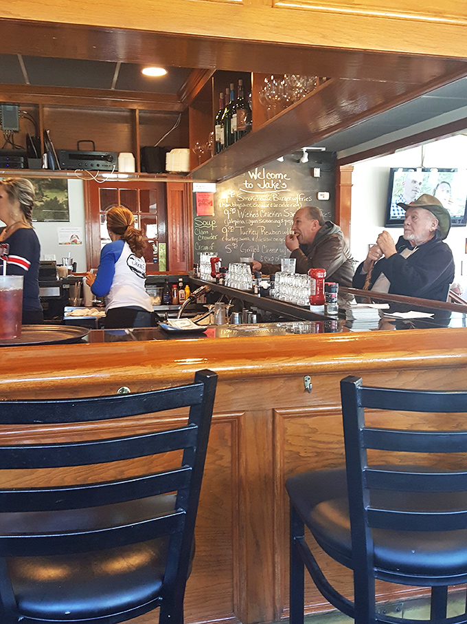 At the bar, stories flow as freely as the drinks while the chalkboard tempts with daily specials.