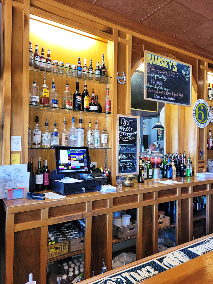 A bar stocked with Kentucky's finest spirits and local brews. The chalkboard specials and wooden shelving create that perfect "everybody knows your name" atmosphere.