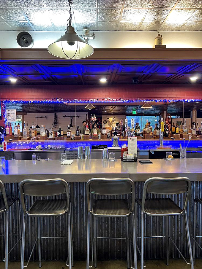 The bar gleams with promise under blue lights &ndash; a modern touch in this temple to traditional barbecue.