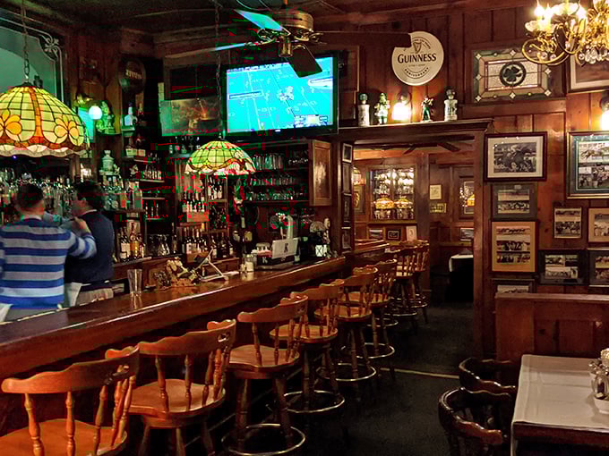 The bar area combines Irish pub warmth with Kentucky hospitality. Those Tiffany-style lamps have witnessed countless toasts, deals, and first dates.