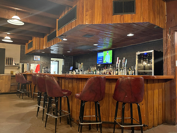 The classic bar where cold drinks flow and tall tales grow taller with each perfectly grilled bite.