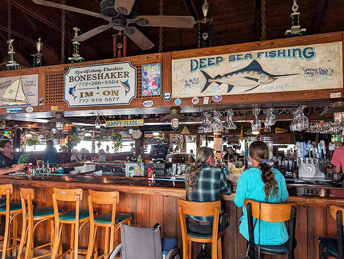 A bar that says "pull up a stool and tell me about the one that got away." Fishing trophies overhead judge your story's authenticity.