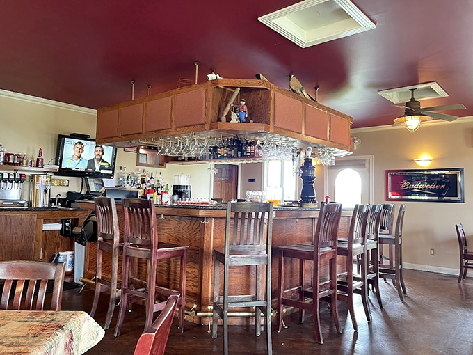 The bar area stands ready for those who believe dinner tastes better with a view of where drinks happen.