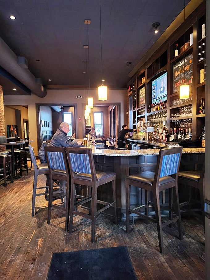 The bar area invites you to perch on a comfortable stool and contemplate life's important questions, like "Manhattan or Old Fashioned tonight?"